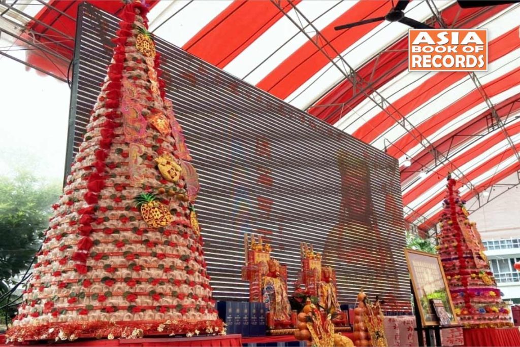 Tallest food towers made on the birthday of a deity - Asia Book of Records