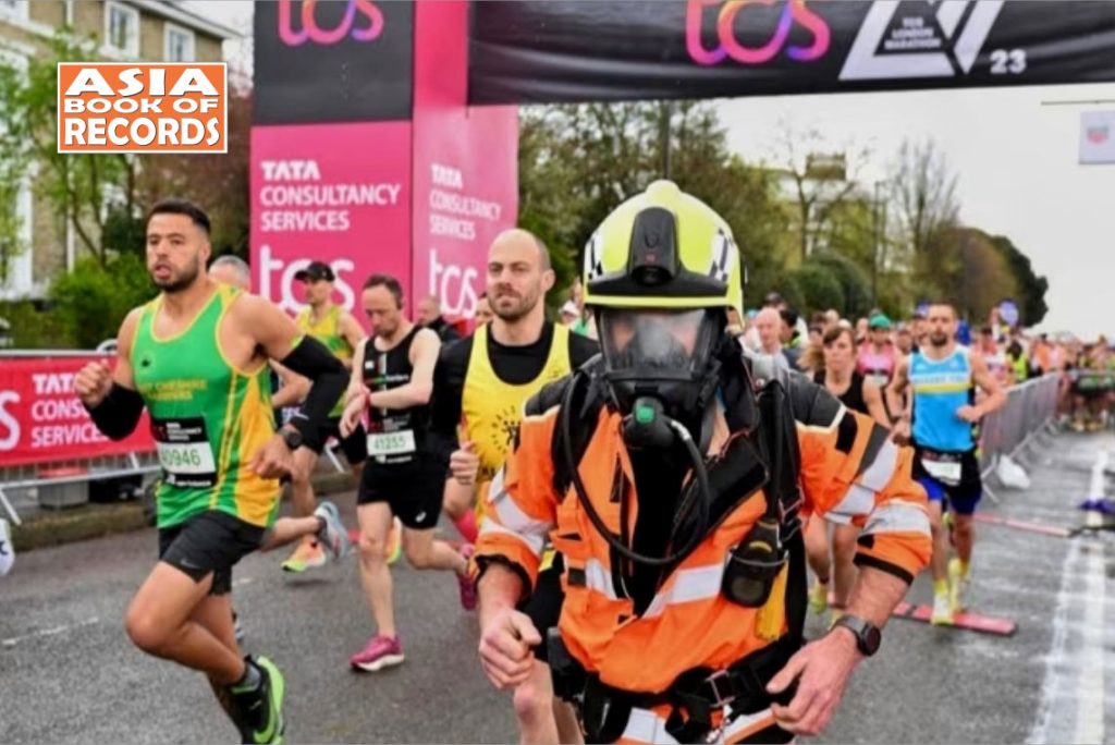 Fastest marathon runner in a firefighter’s uniform and breathing ...