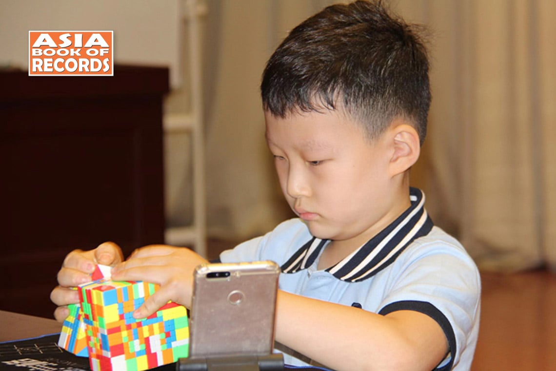 Youngest child to solve a 12×12×12 Rubik’s Cube - Asia Book of Records
