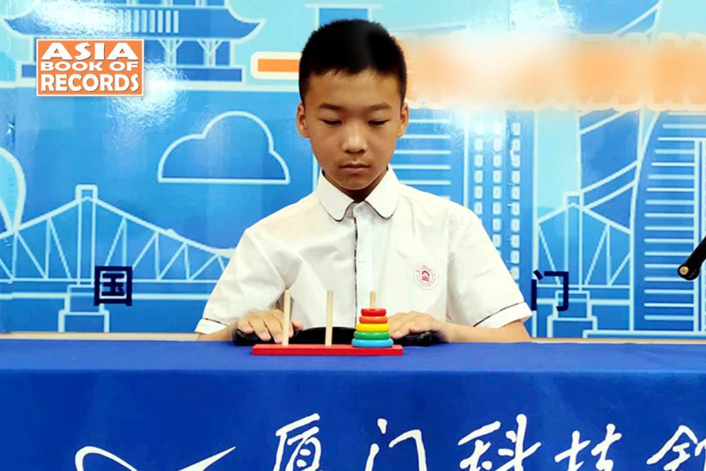 Fastest kid to solve a 5 level Tower of Hanoi puzzle - Asia Book of Records