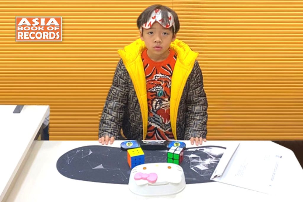 Youngest kid to solve a 2x2x2 and a 3x3x3 Rubik’s Cube blindfolded ...